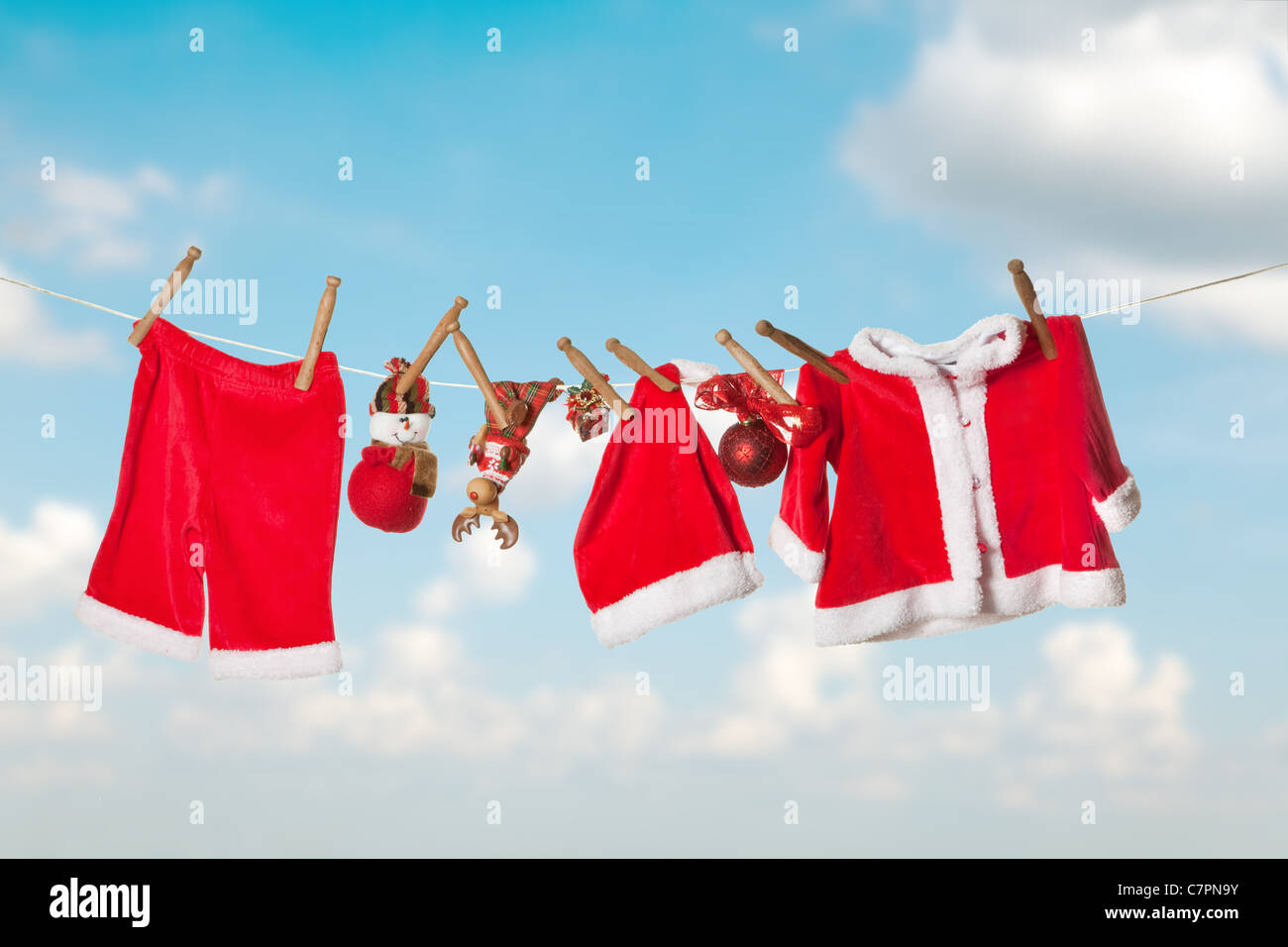 Santa claus laundry hanging on a clothesline in the sky Stock Photo - Alamy