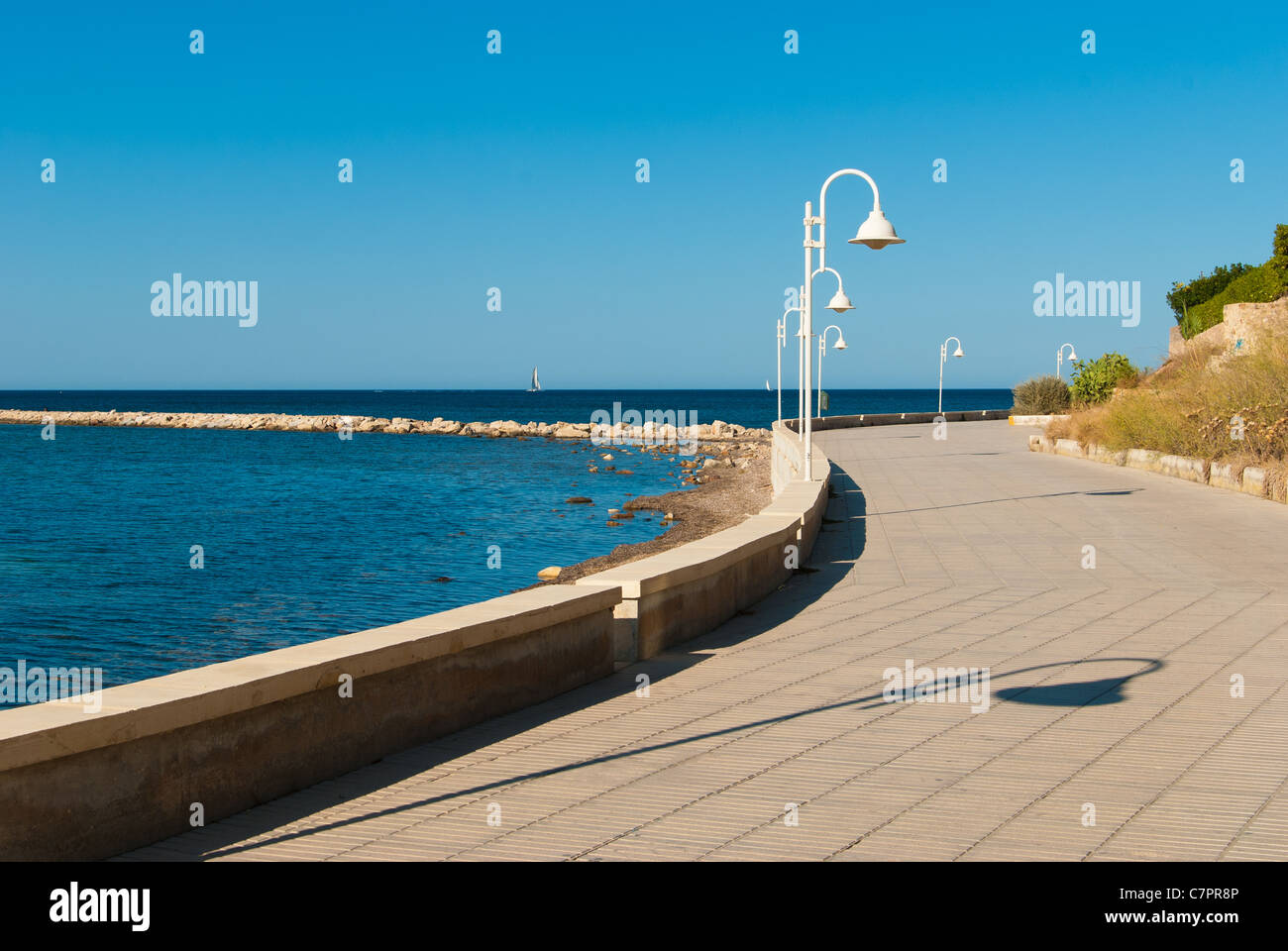 Idyllic Mediterranean beach promenade on a sunny afternoon Stock Photo ...