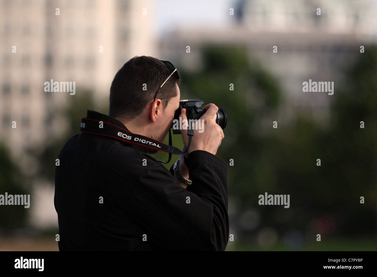 Man taking a picture with a canon camera hi-res stock photography and ...