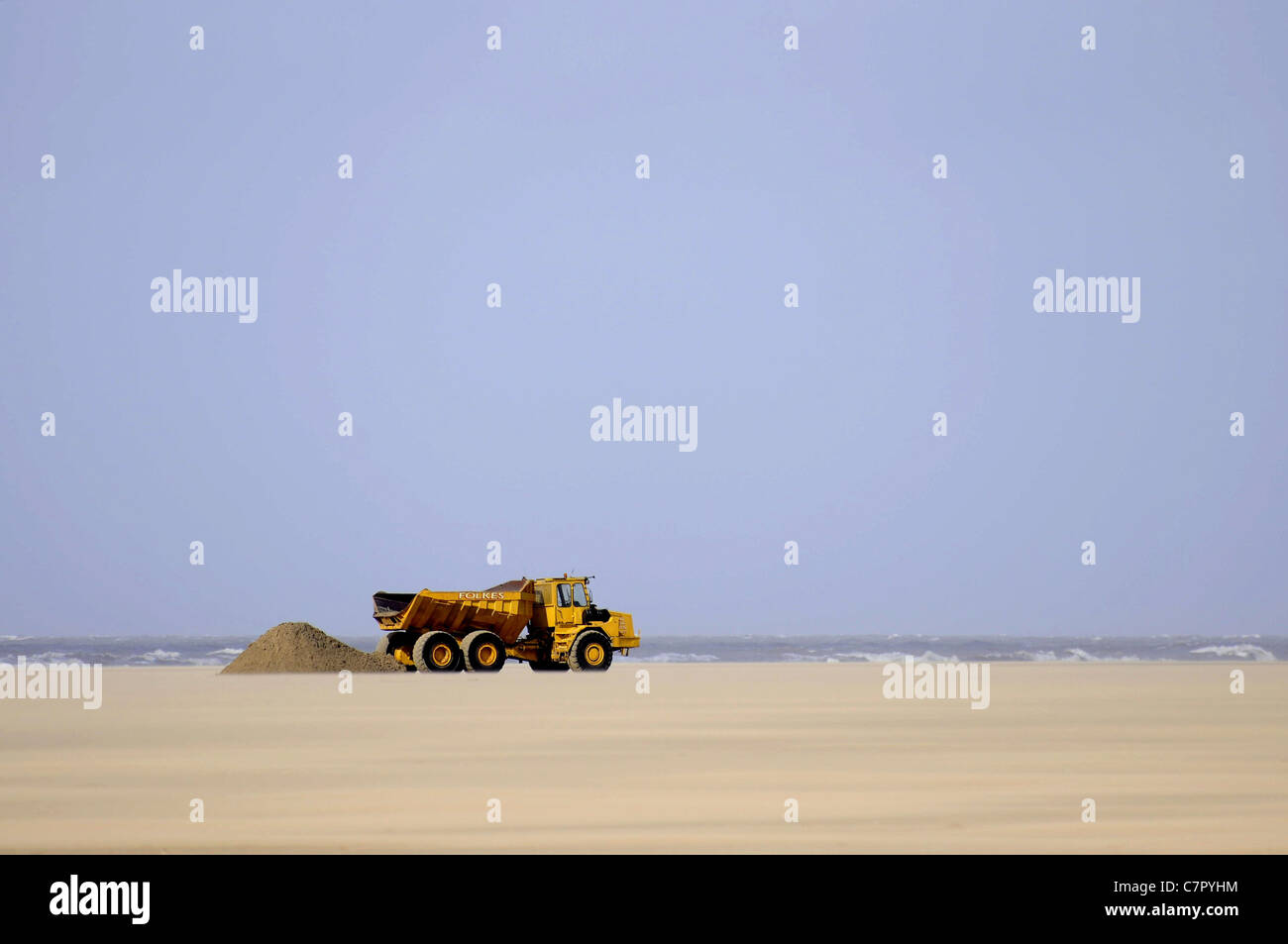 Yellow tipper truck on Lytham St Annes beach Stock Photo - Alamy