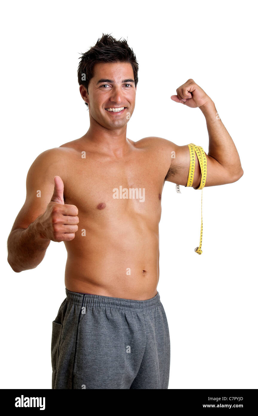 Muscular young man with measuring tape Stock Photo - Alamy