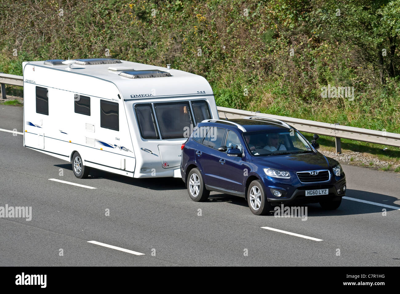 White camper van or caravan on a road or motorway Stock Photo - Alamy