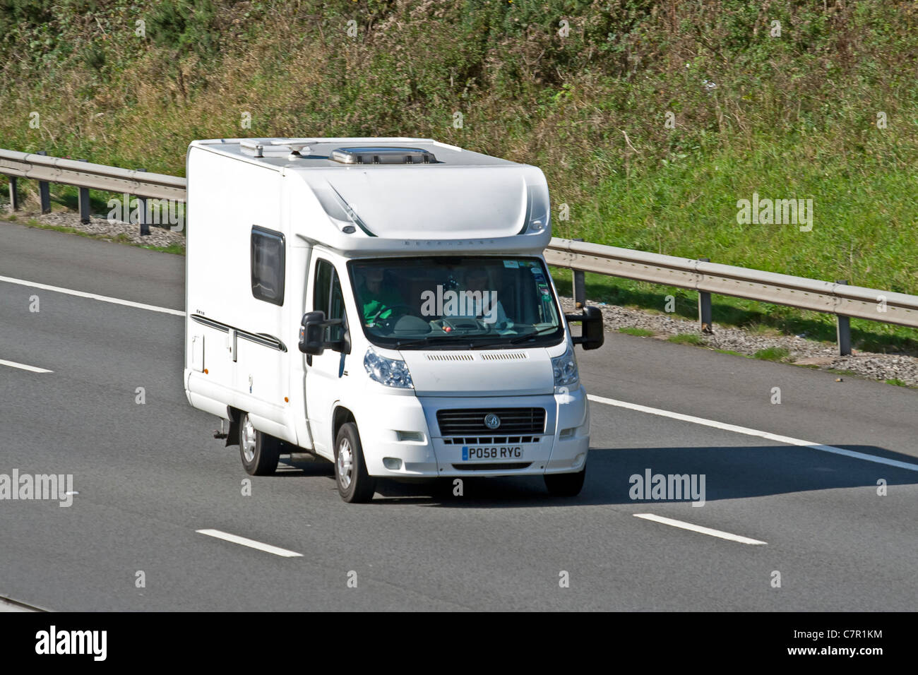 White camper van or caravan on a road or motorway Stock Photo - Alamy