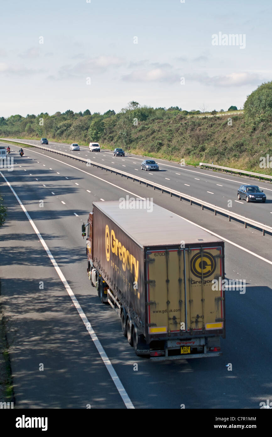 Lorries or trucks on a motorway or road Stock Photo - Alamy