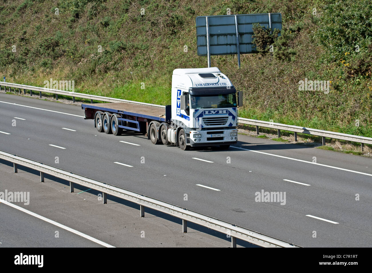 Lorries or trucks on a motorway or road Stock Photo - Alamy