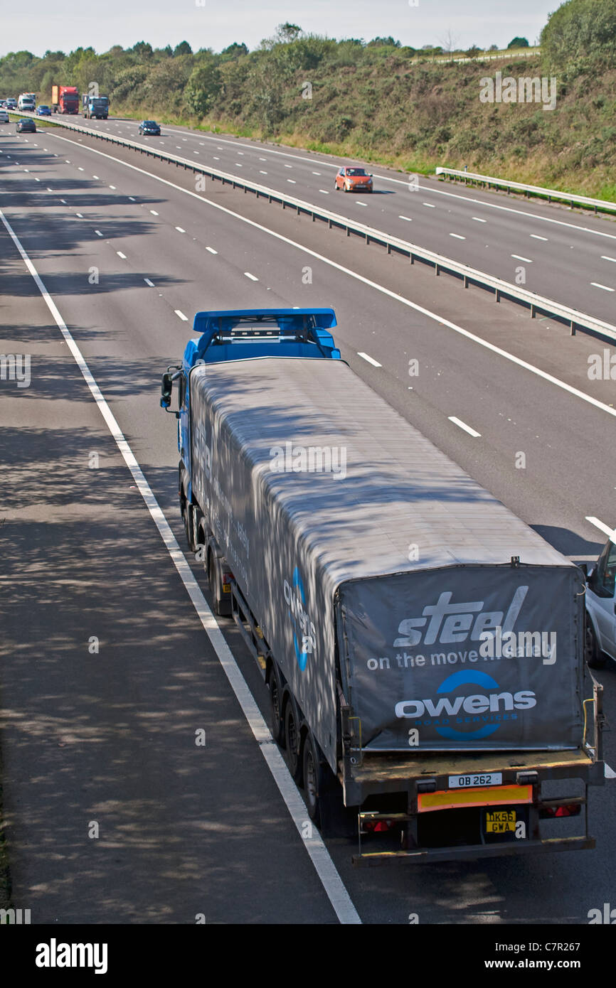 Lorries or trucks on a motorway or road Stock Photo - Alamy