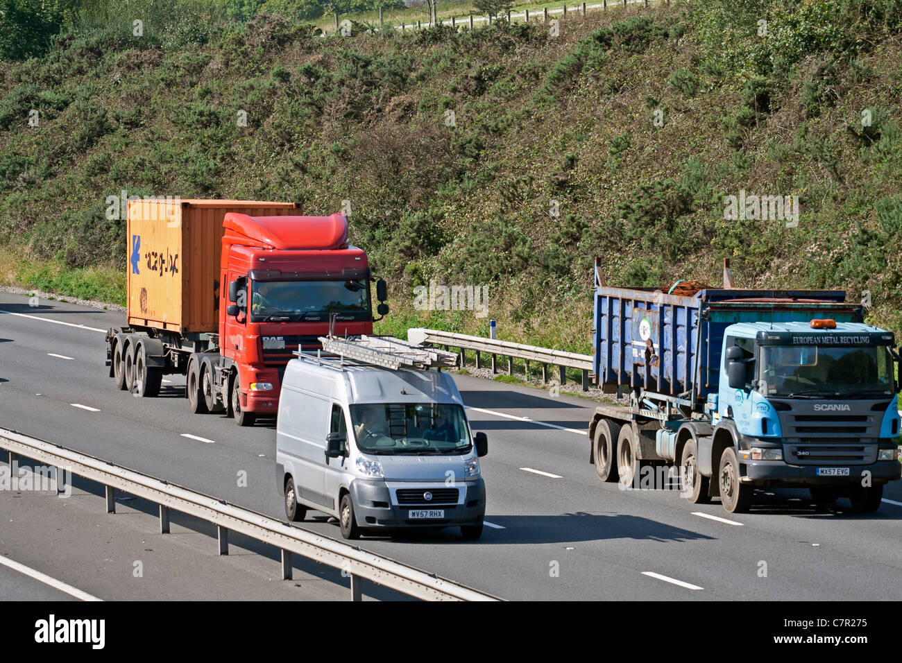 Lorries or trucks on a motorway or road Stock Photo - Alamy