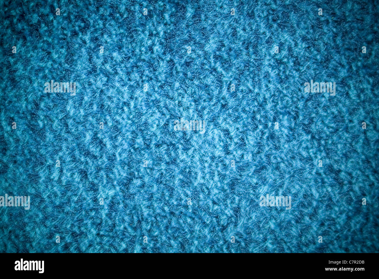 A blue shag carpet texture with added vignetting Stock Photo - Alamy