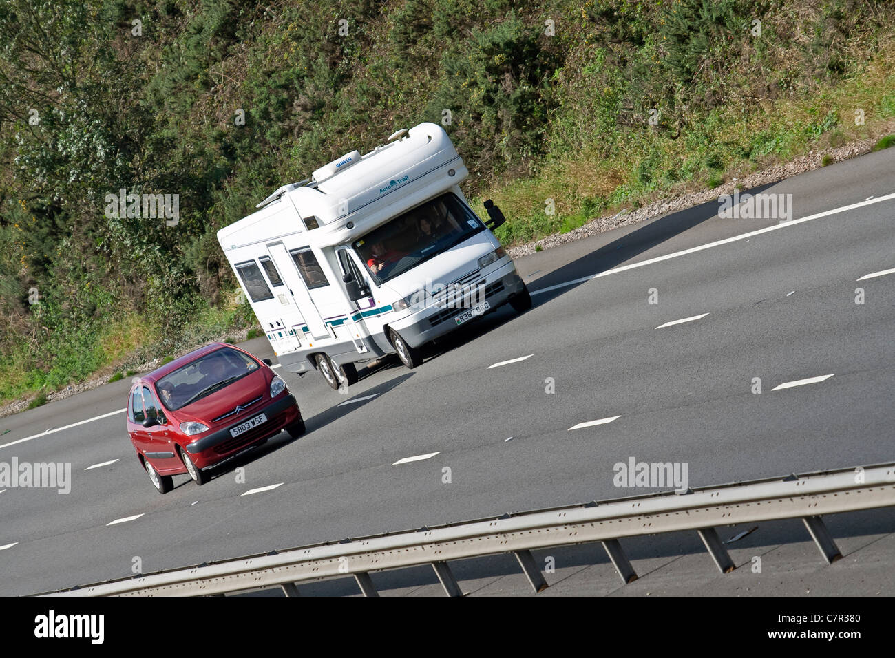 White camper van or caravan on a road or motorway Stock Photo - Alamy