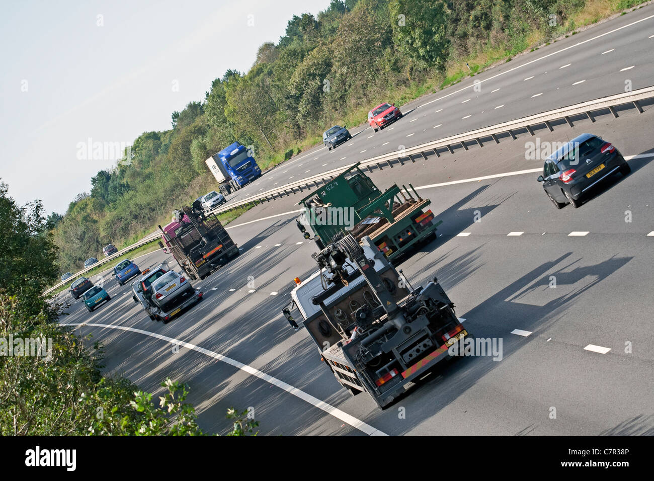 Busy road or motorway with trucks and cars Stock Photo - Alamy