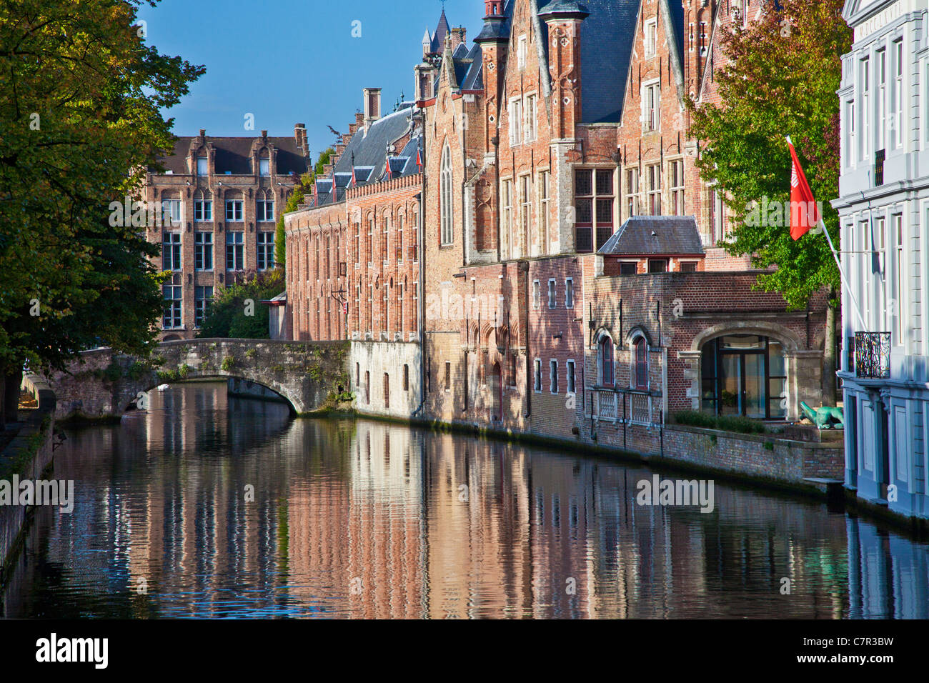 Canal and stone bridge in Bruges, Belgium along the Steenhouwers Dijk ...