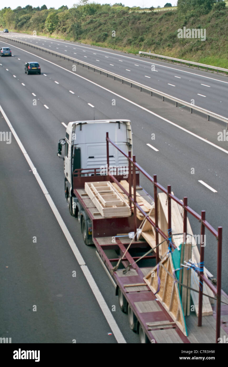 Lorries or trucks on a motorway or road Stock Photo - Alamy