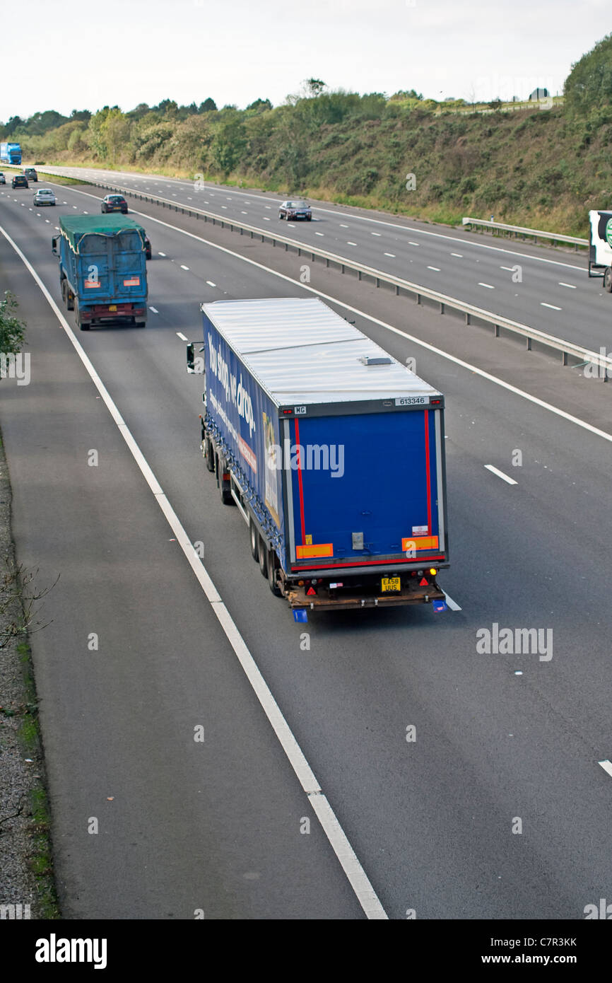Lorries or trucks on a motorway or road Stock Photo - Alamy