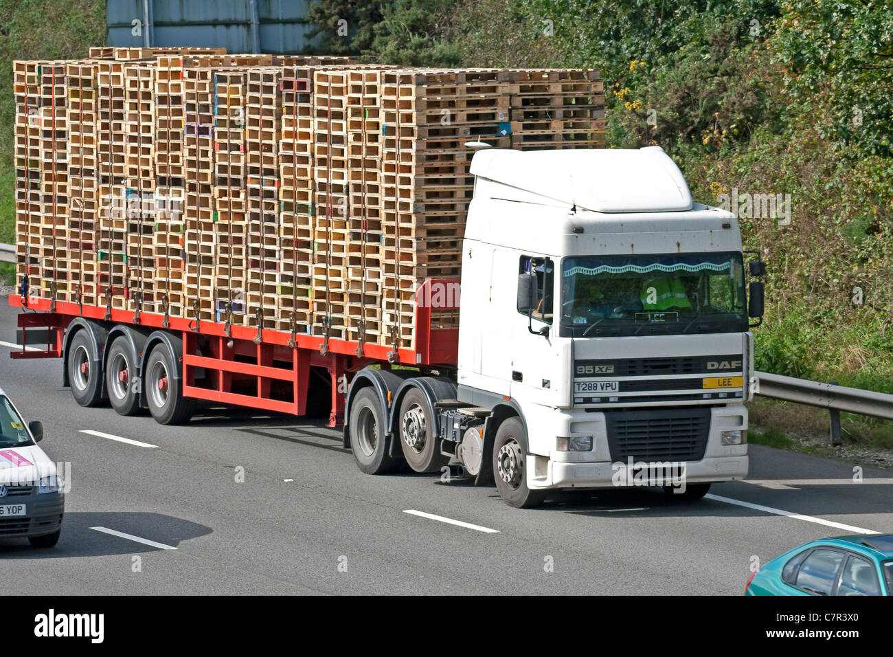 Lorries or trucks on a motorway or road Stock Photo - Alamy