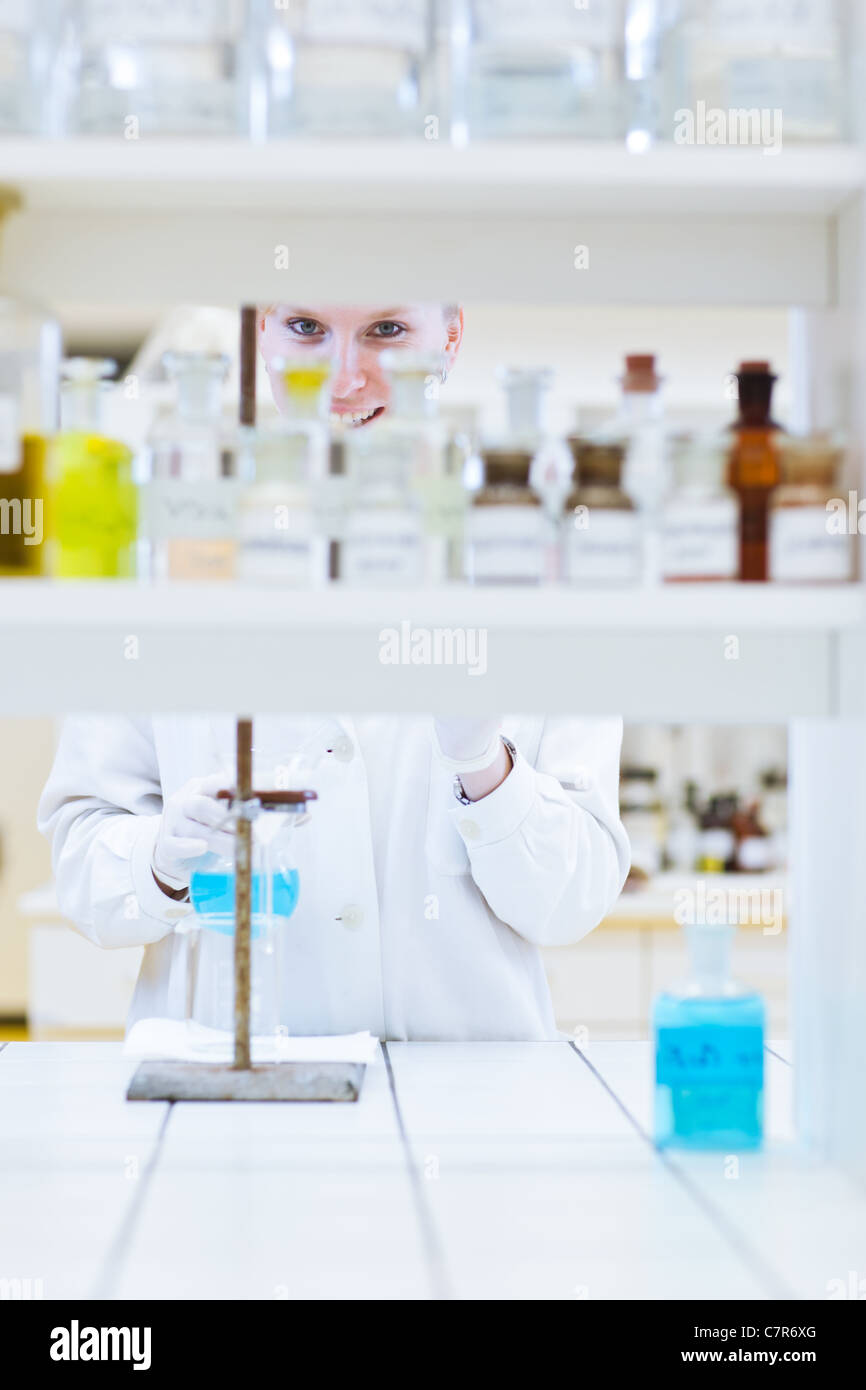 portrait of a female researcher carrying out research in a chemistry ...