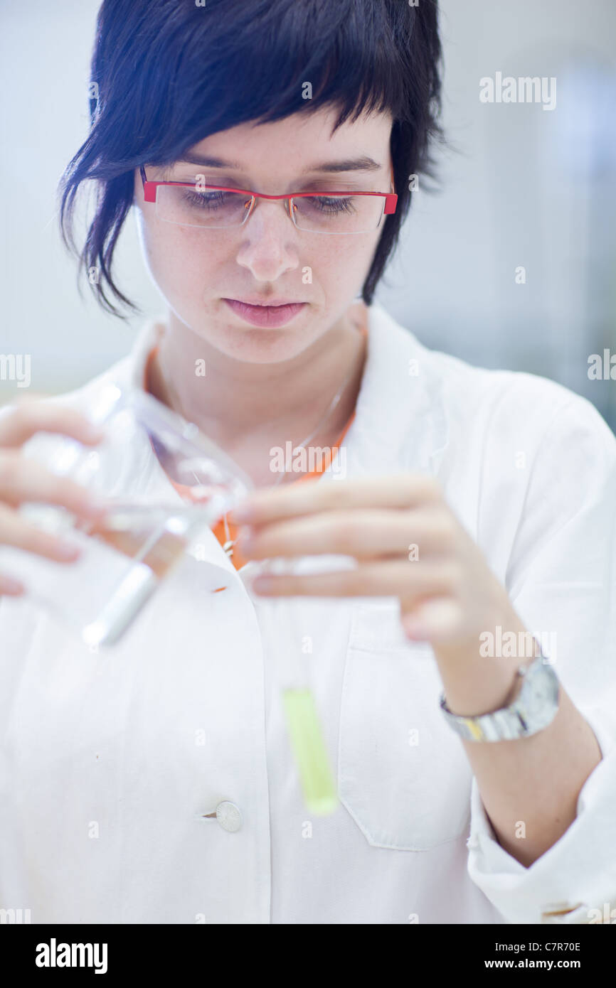 portrait of a female researcher carrying out research in a chemistry ...