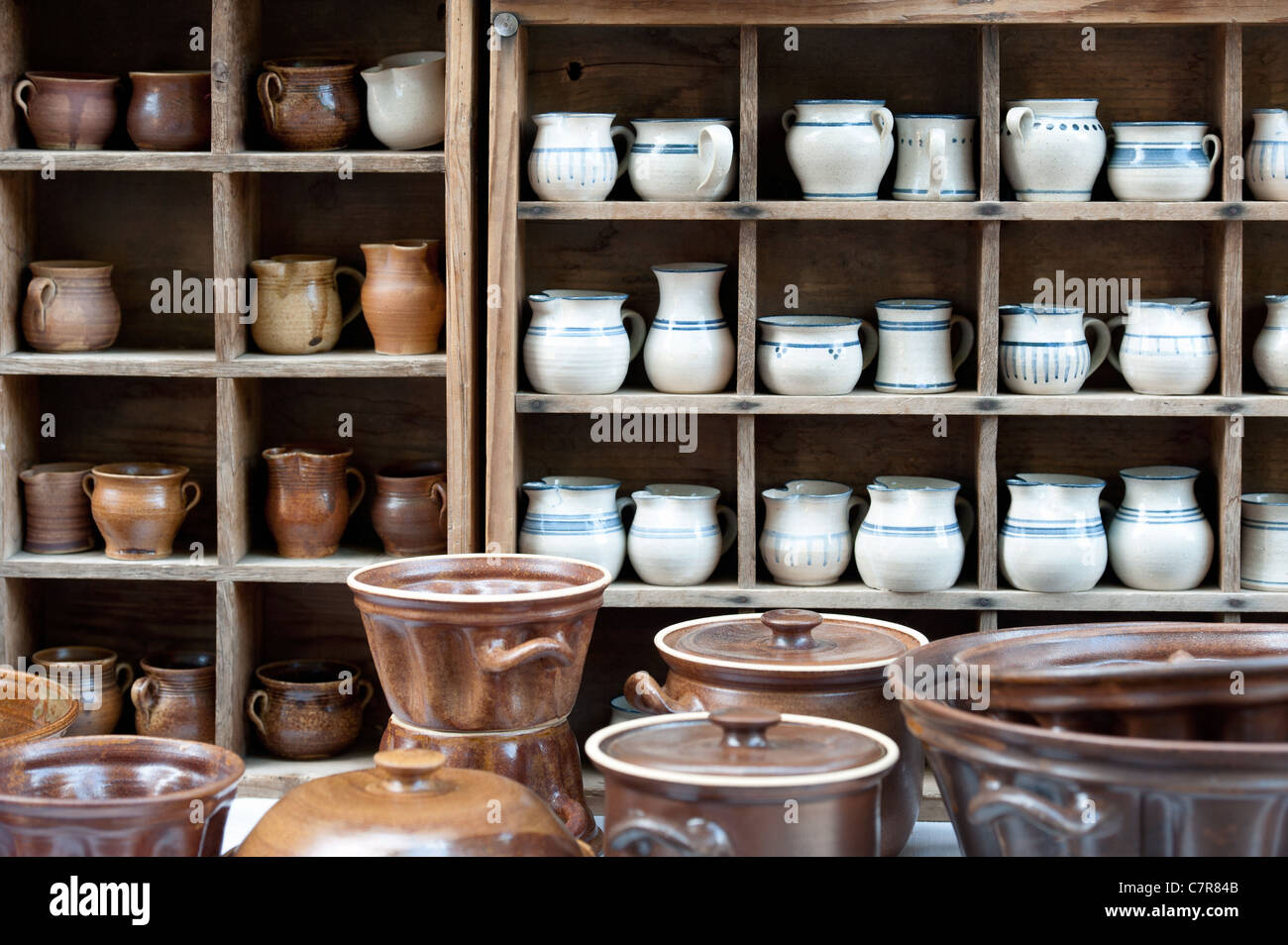 pottery products in wooden rack at the traditional urban market Stock ...