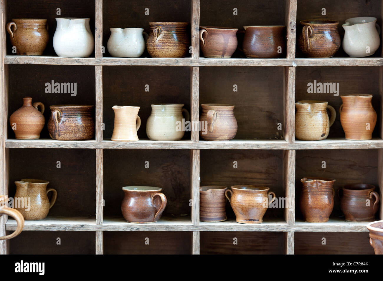 pottery products in wooden rack at the traditional urban market Stock ...