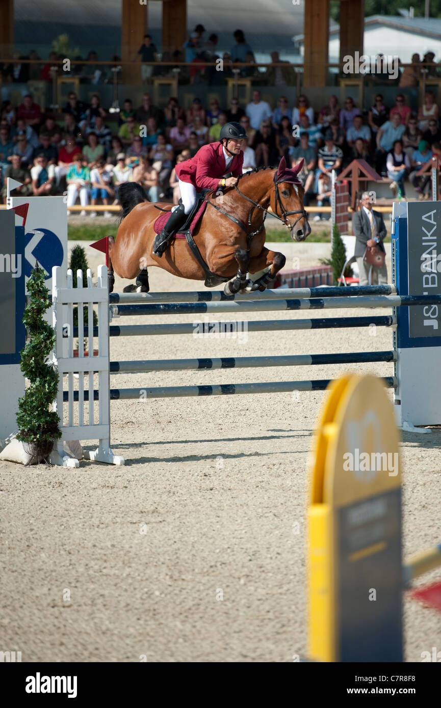 Ondrej ZVARA on horse ARON 8 (CZE) clears a jump at SHARON Grand Prix ...