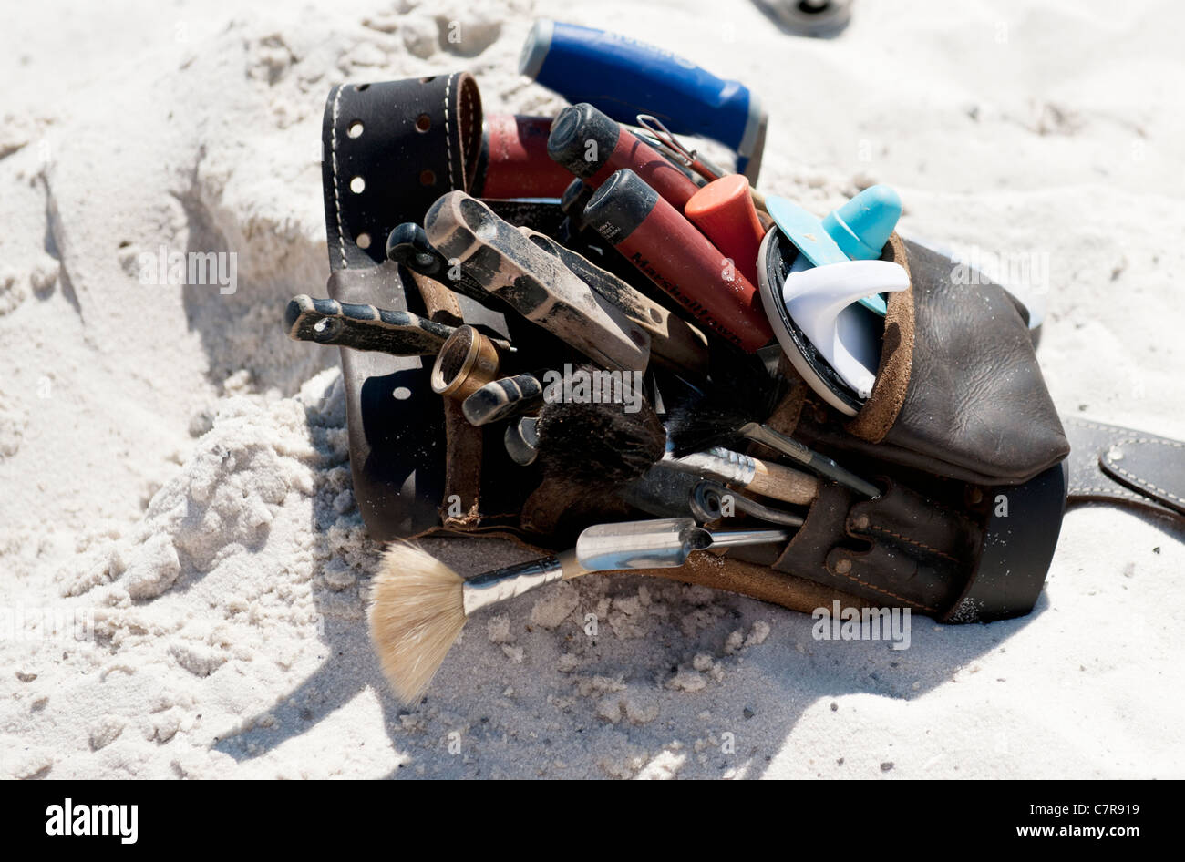A sand sculptors tools laying in the sand Stock Photo - Alamy