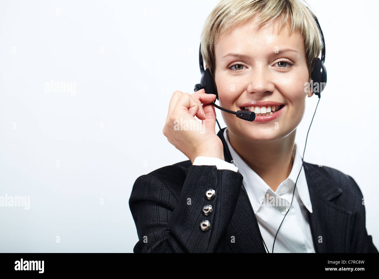 Portrait of friendly customer service representative isolated on white ...