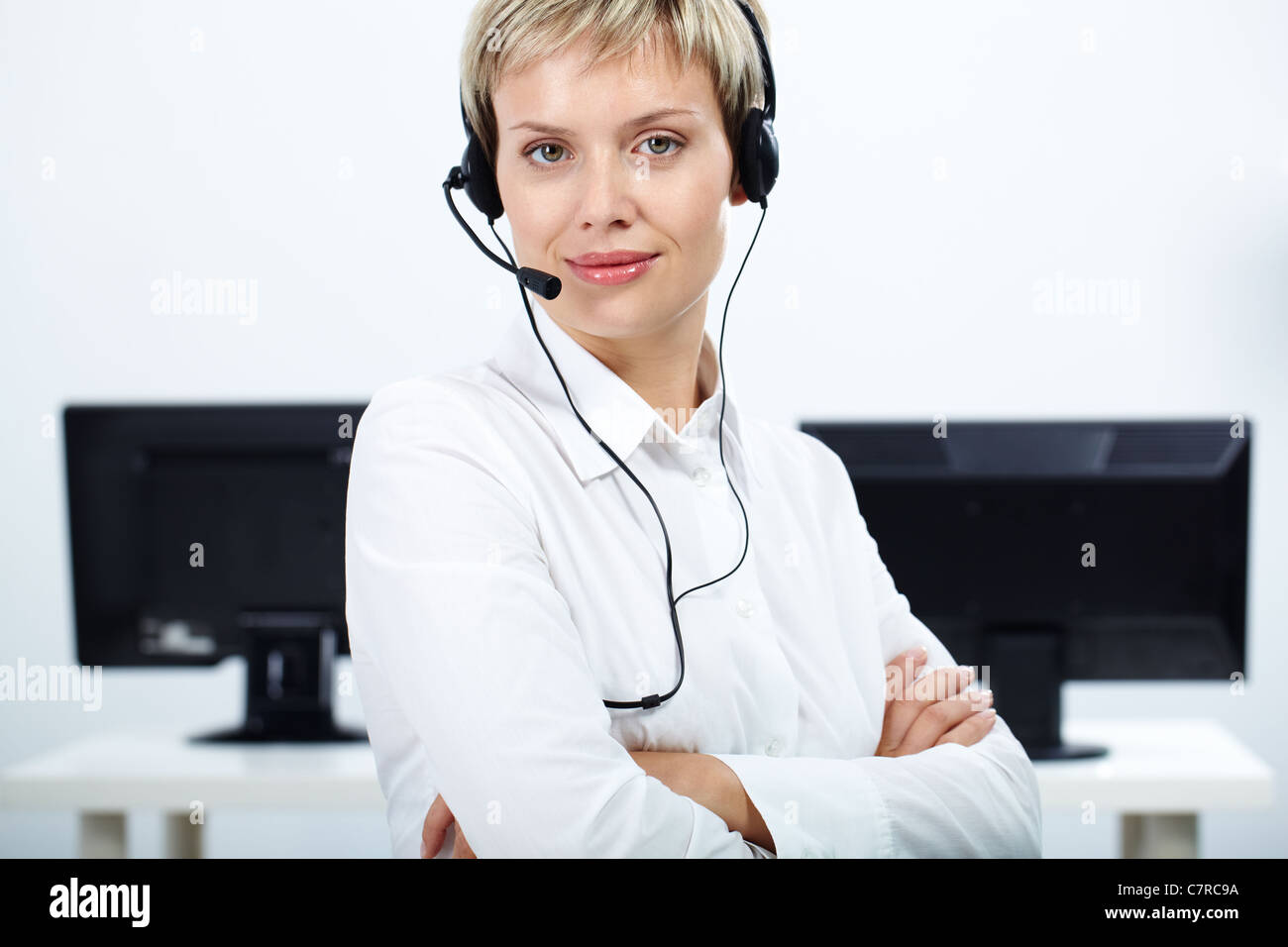 Portrait of customer service operator looking at camera Stock Photo - Alamy