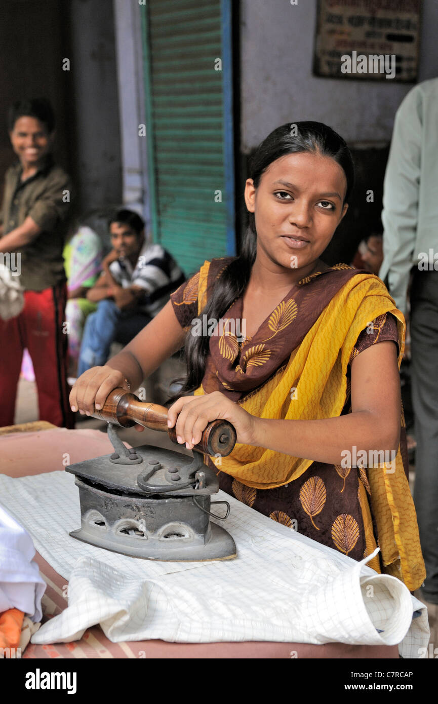 Young woman ironing with traditional coal-fired iron Stock Photo - Alamy