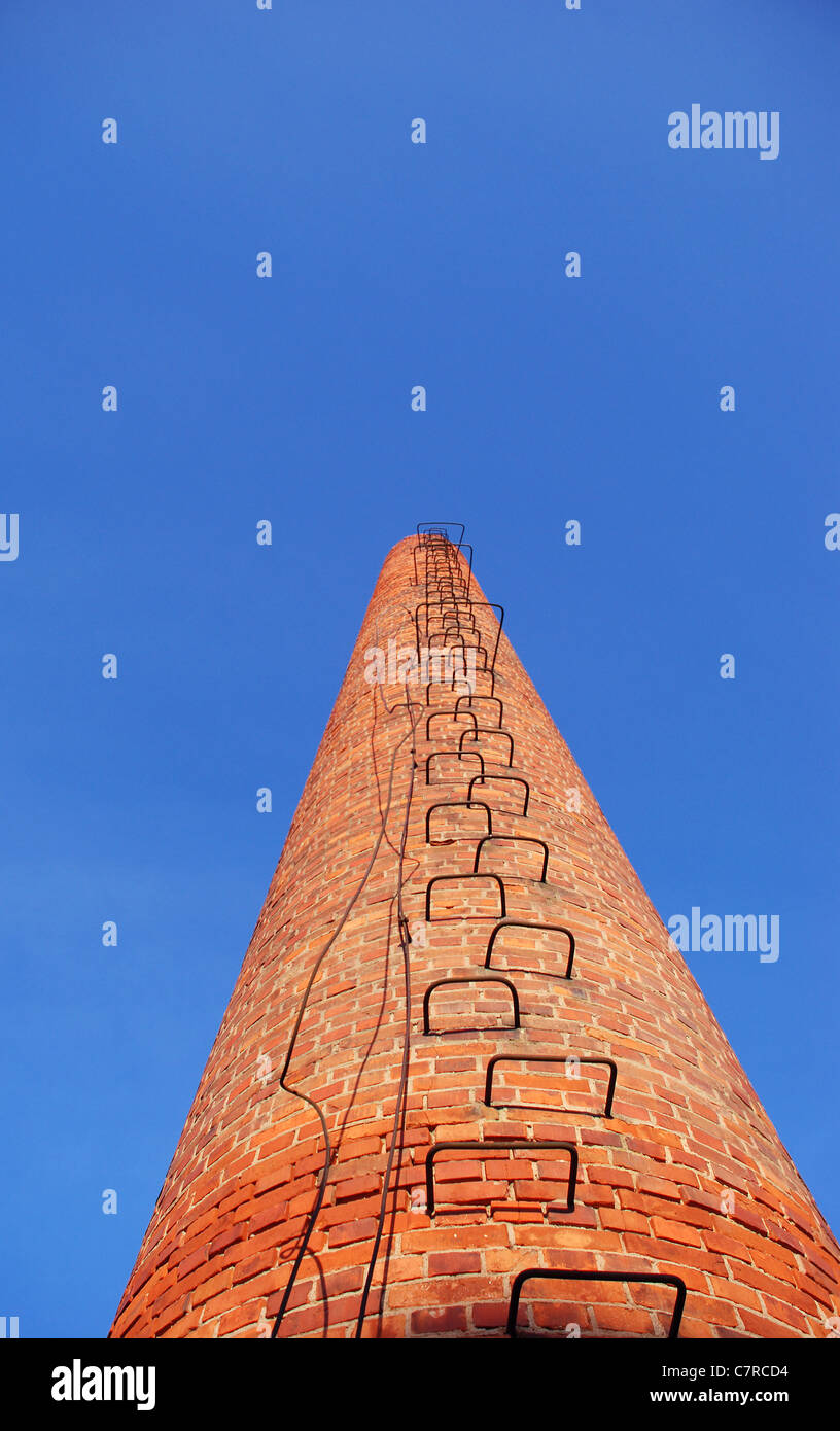 red bricks chimney and blue sky background Stock Photo - Alamy