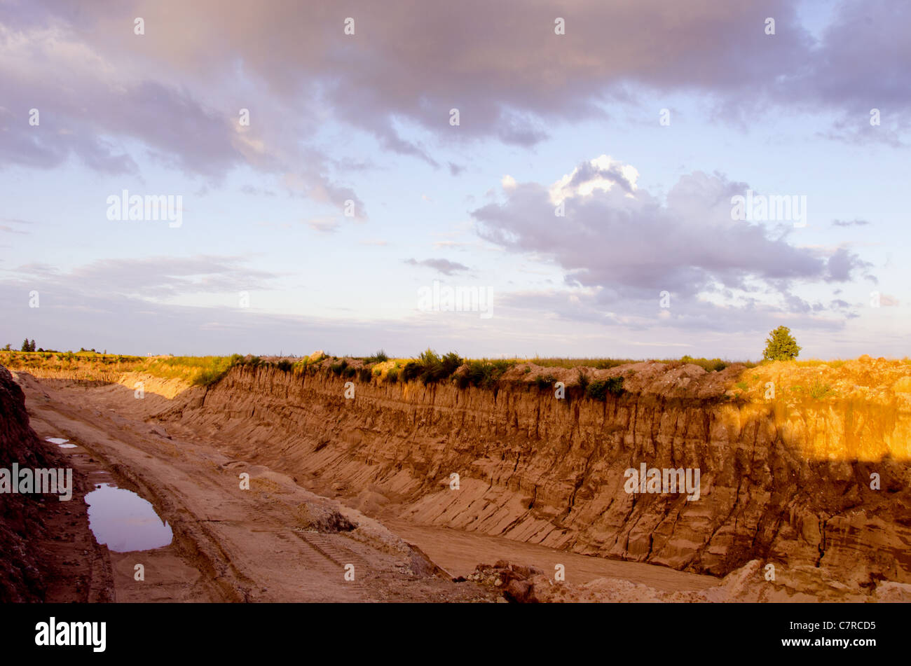 industrial clay quarry in summer evening Stock Photo - Alamy