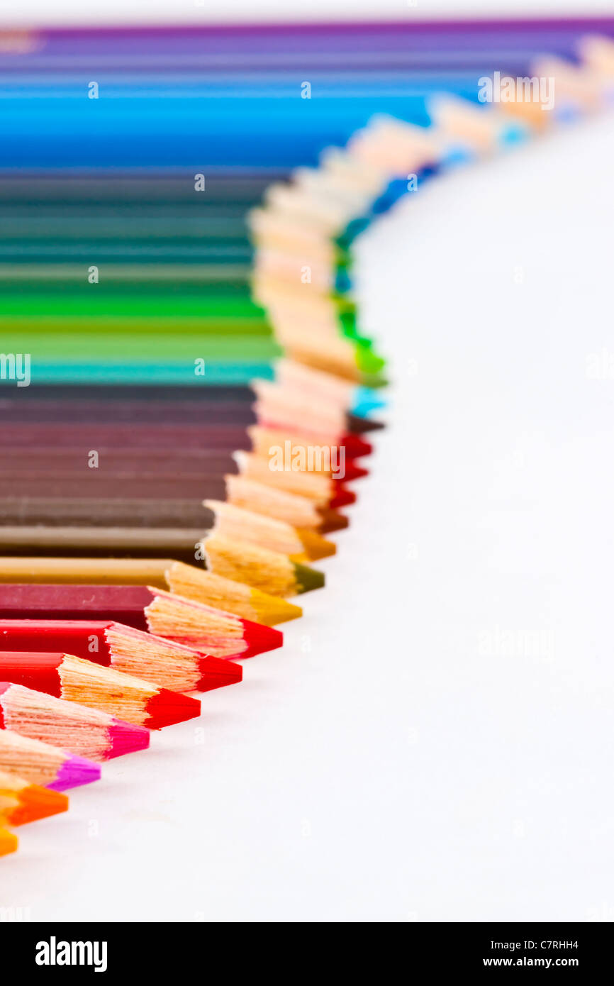 Colorful pencils curve line white isolated background Stock Photo - Alamy