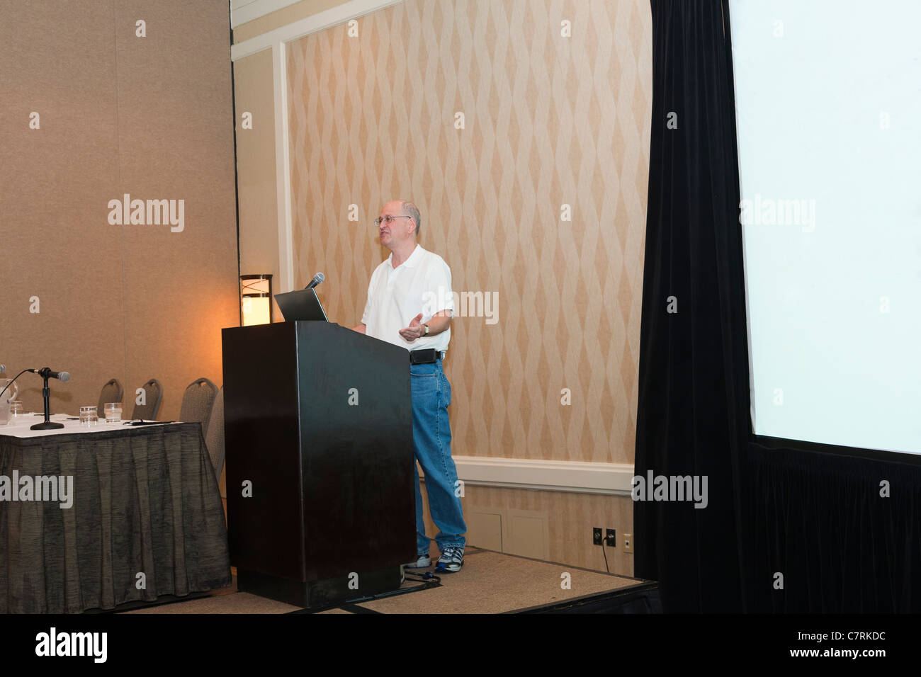 Man speaking in a convention Stock Photo - Alamy