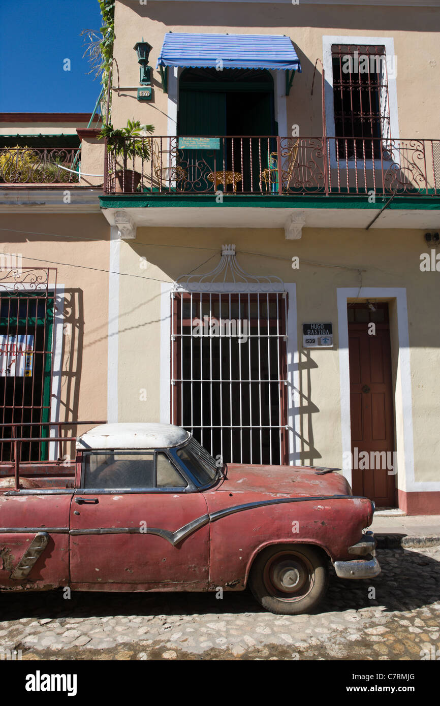 Colonial house with parked vintage car Stock Photo - Alamy