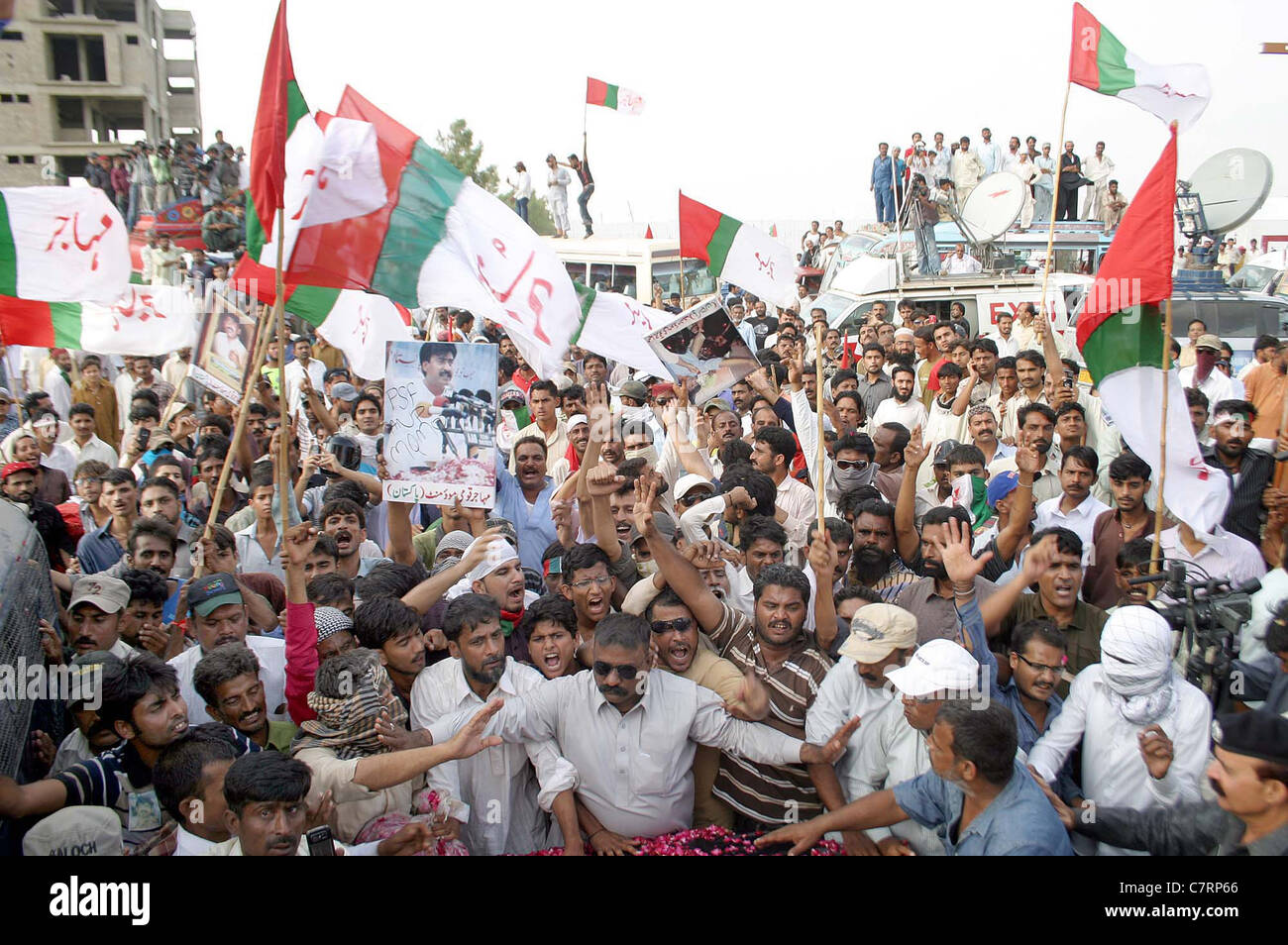 A Kalash man and baby at the summer festival of the Kalash people, in ...