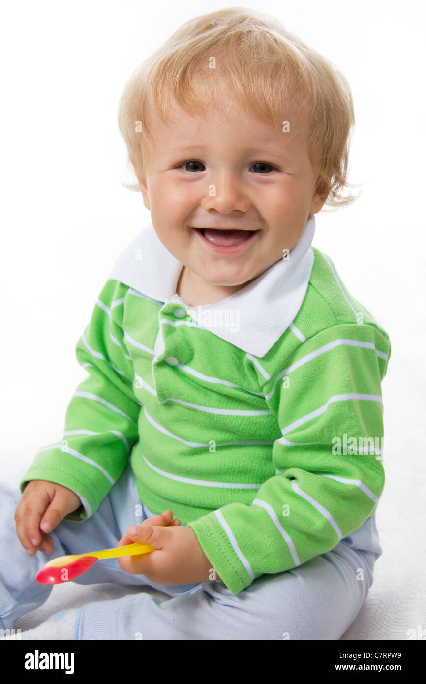 Portrait of sitting down small child Isolated on white Stock Photo - Alamy