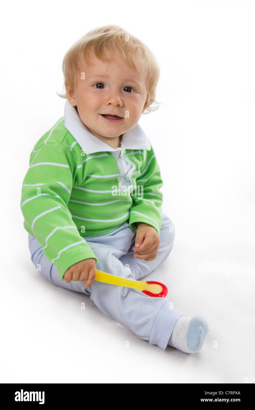 Portrait of sitting down small child Isolated on white Stock Photo - Alamy