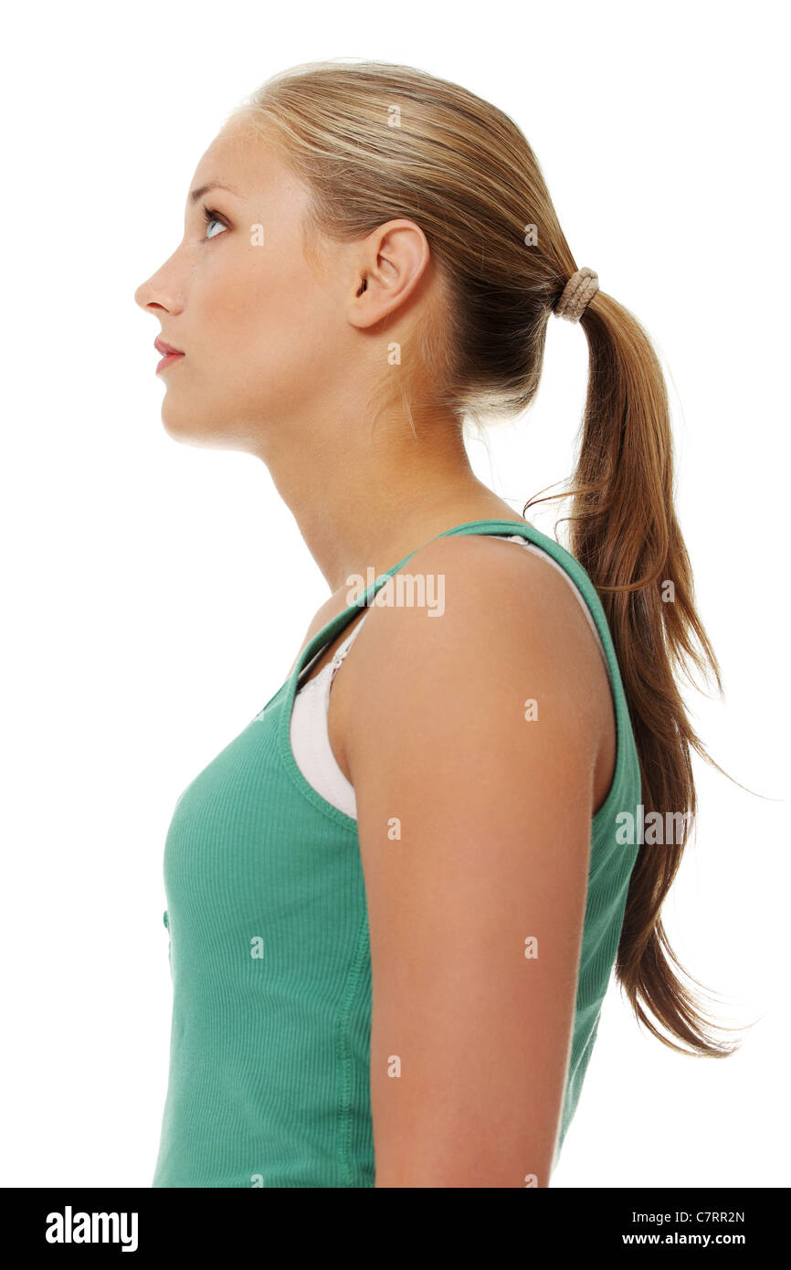 Side view of happy attractive female looking up. Isolated on white ...