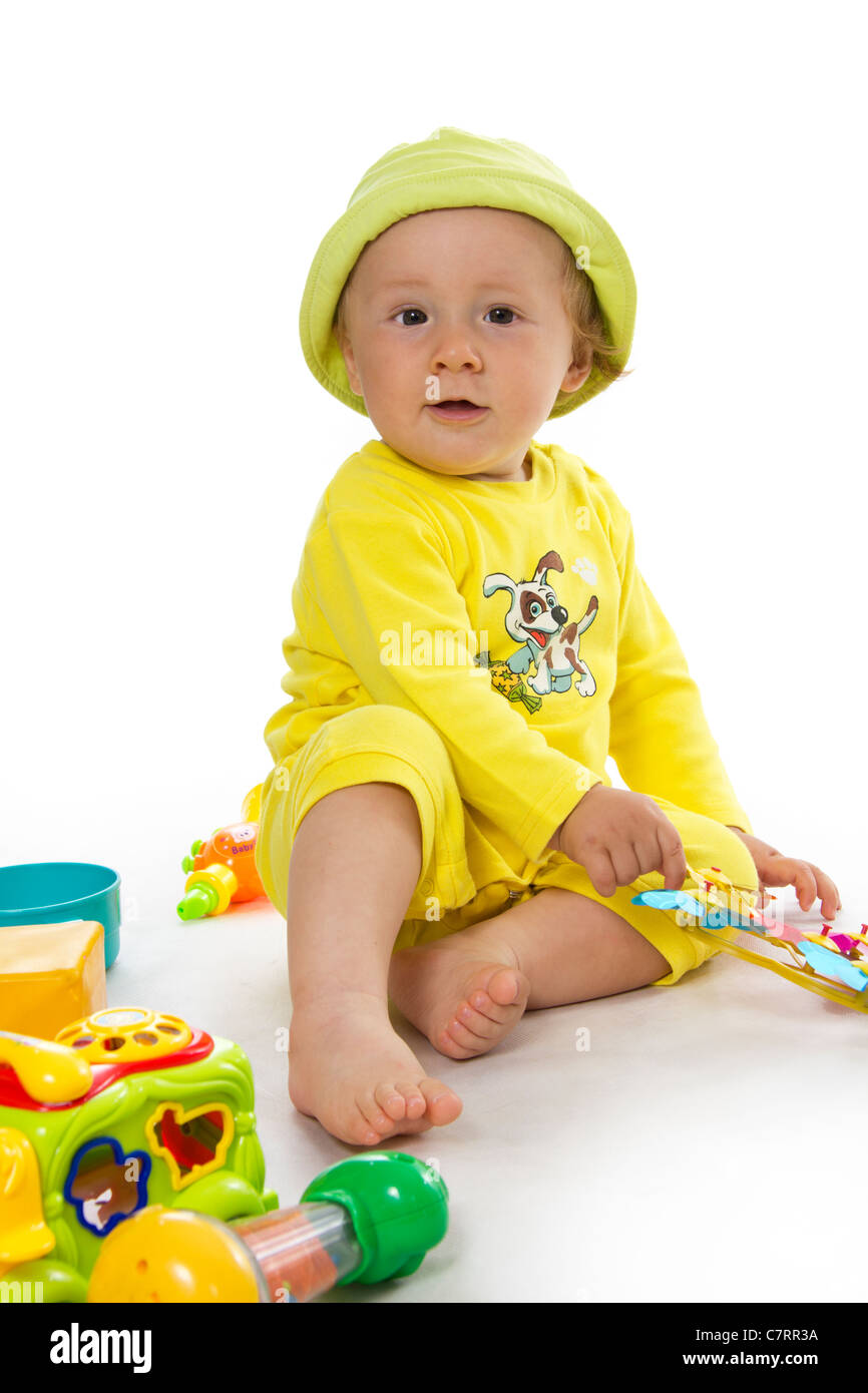 Portrait of sitting down small child Isolated on white Stock Photo - Alamy