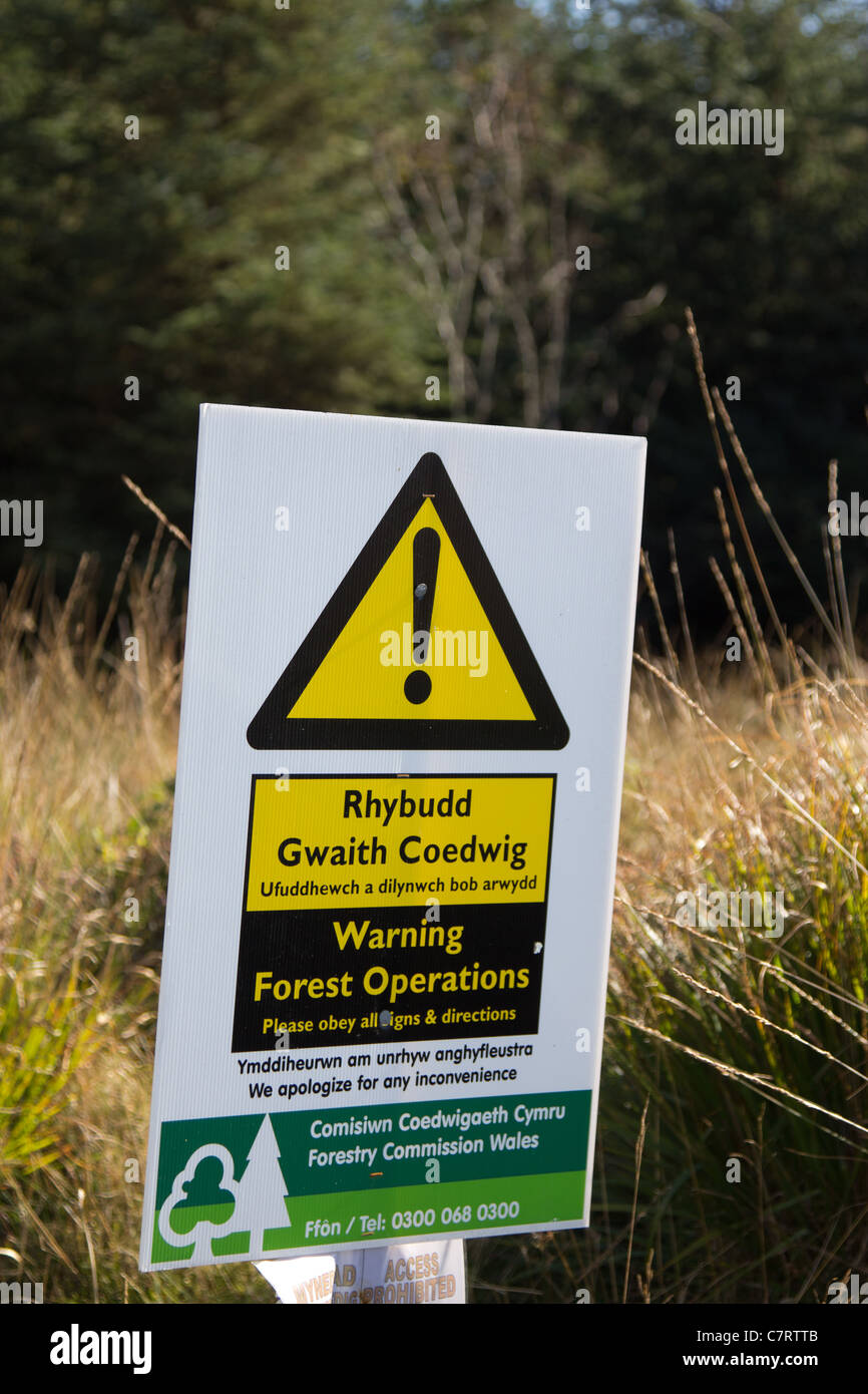 Bilingual forestry operations warning sign Stock Photo - Alamy