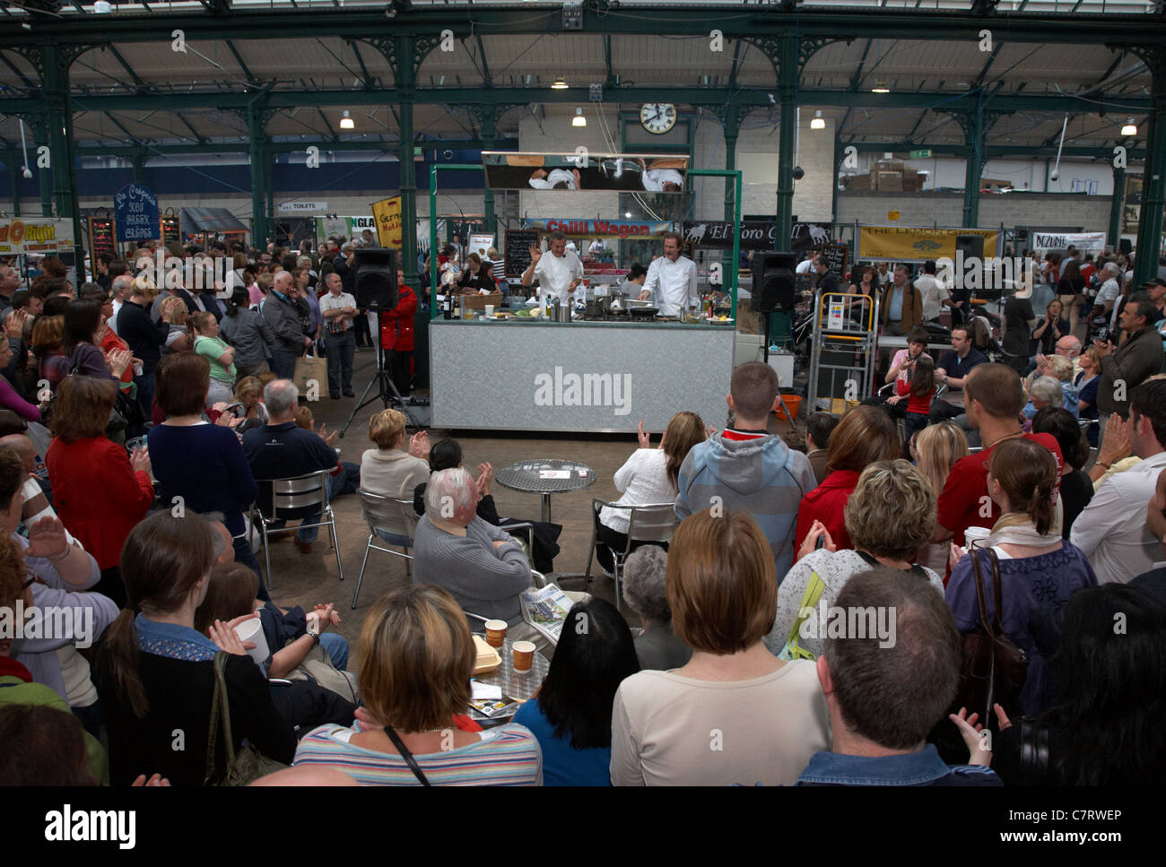 Chefs perform a cookery demonstration at the weekly City Food and ...