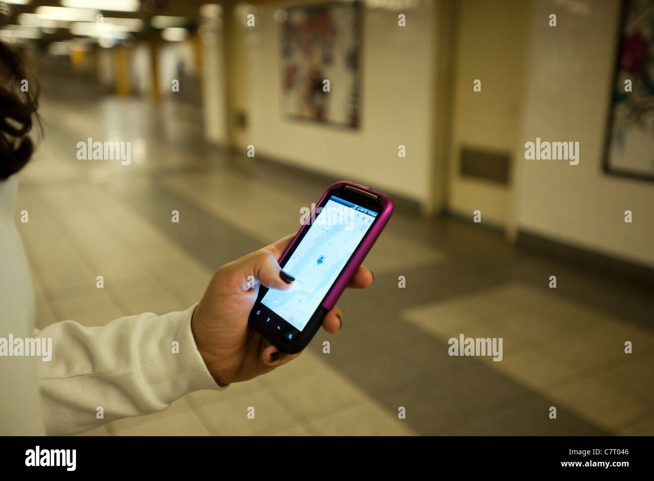Subway riders demonstrate service on their cell phones at the W14th ...