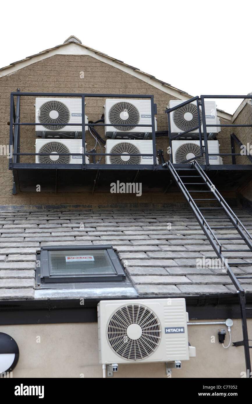 Air conditioning units on side of commercial building Stock Photo - Alamy
