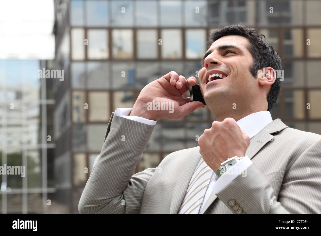 Businessman overjoyed with his phone call Stock Photo - Alamy