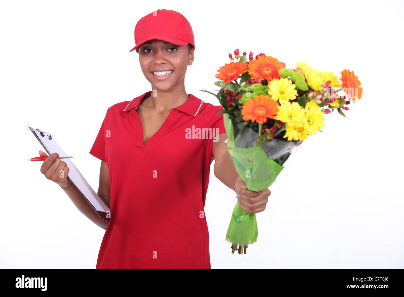 a delivery woman bringing a flowers bouquet Stock Photo - Alamy