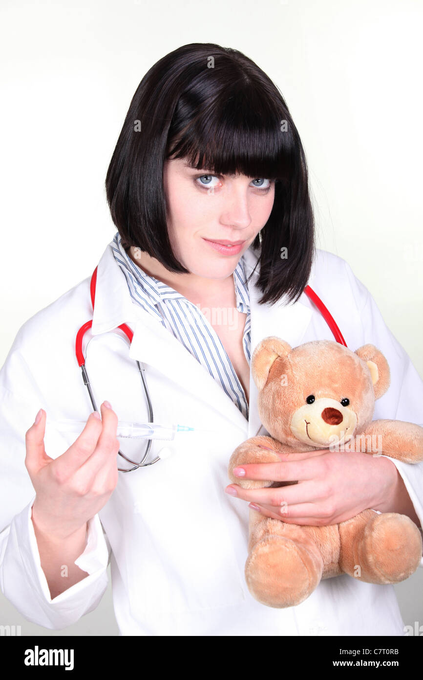nurse making an injection to a teddy bear Stock Photo - Alamy