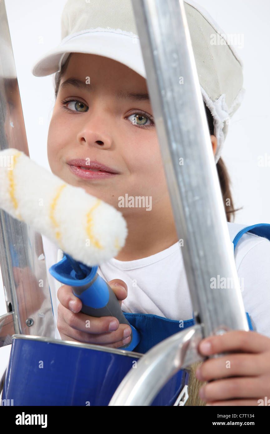 Young child dressed in adult's decorating clothes Stock Photo - Alamy