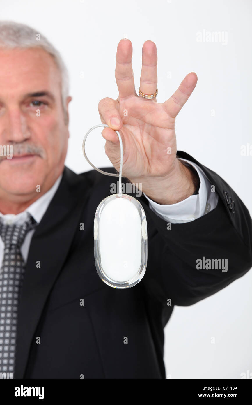 Grey haired man holding computer mouse Stock Photo - Alamy