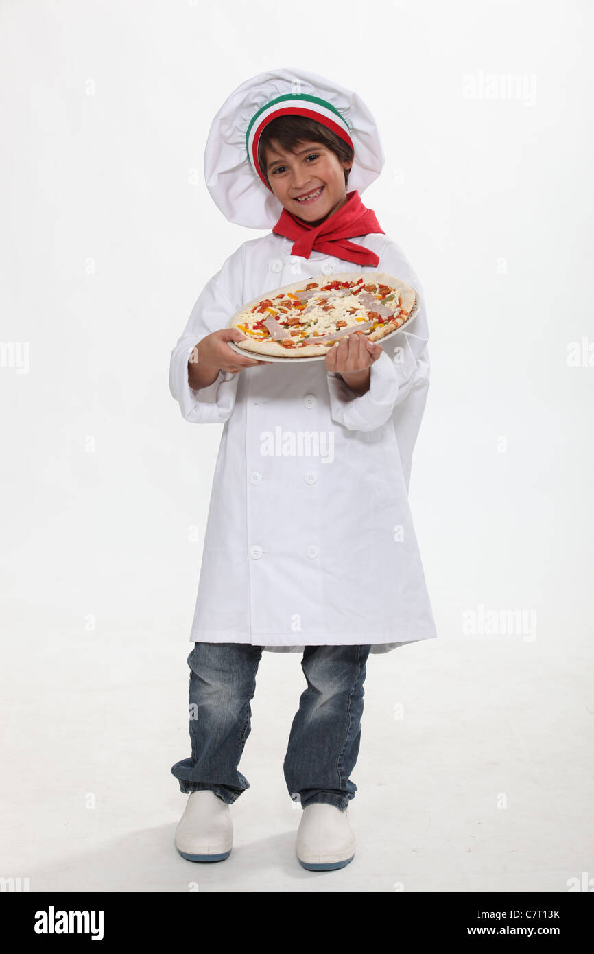 Little boy dressed as pizza chef Stock Photo - Alamy