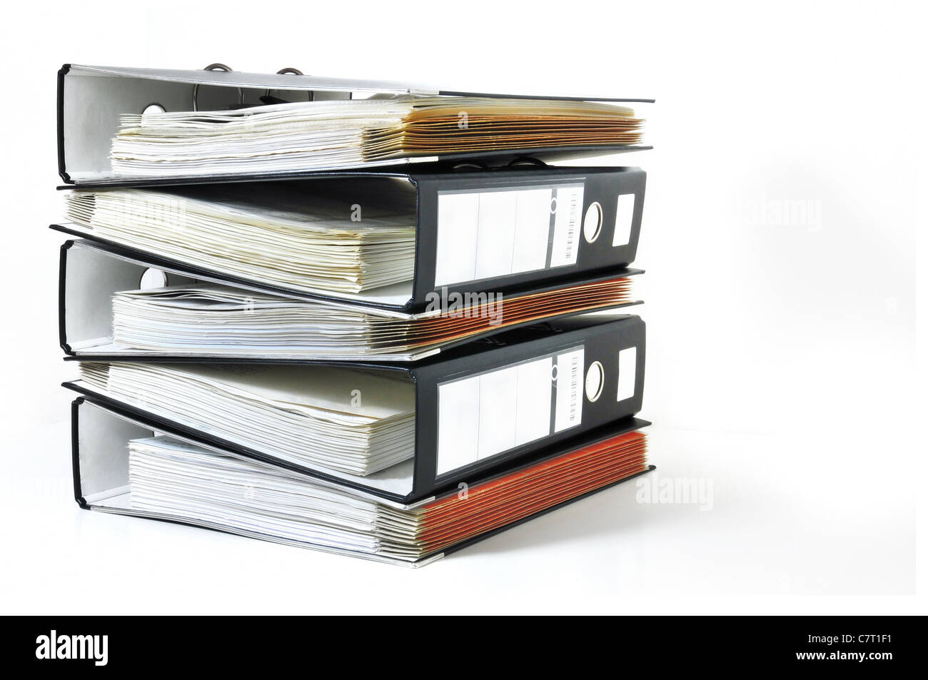 Various black colored office binders with important documents on white ...