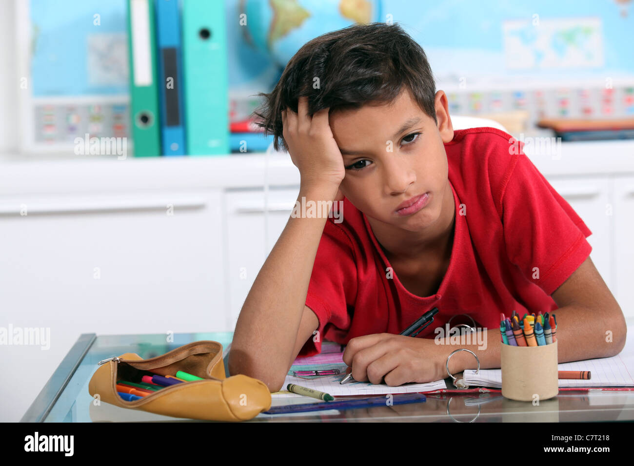 Little boy bored in art class Stock Photo - Alamy