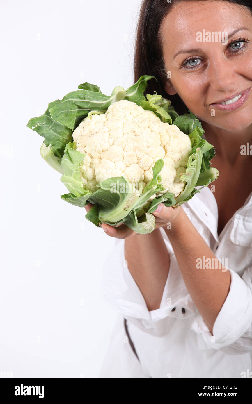 Woman holding cauliflower Stock Photo - Alamy